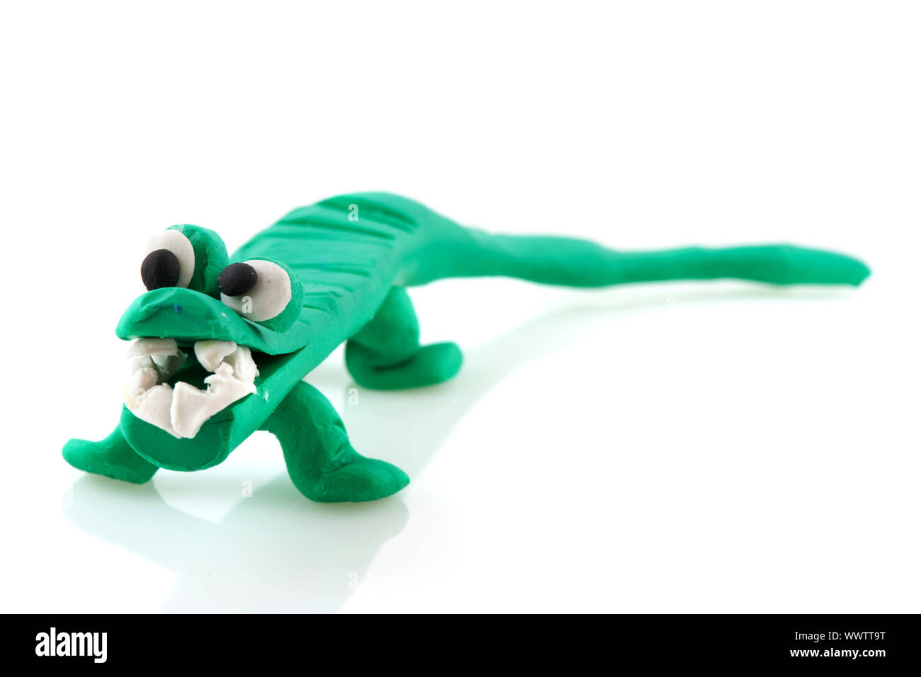 funny crocodile made from clay isolated over white Stock Photo - Alamy