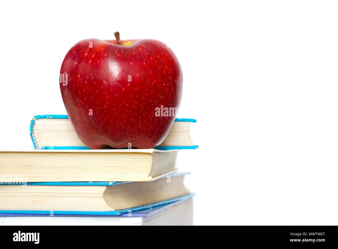 Red apple and stack of books for school Stock Photo - Alamy