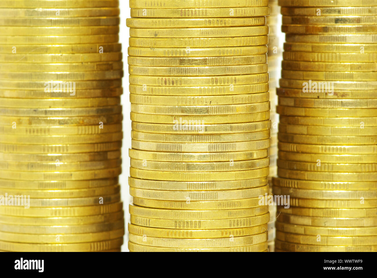 towers of coins isolated on a whiteness Stock Photo - Alamy