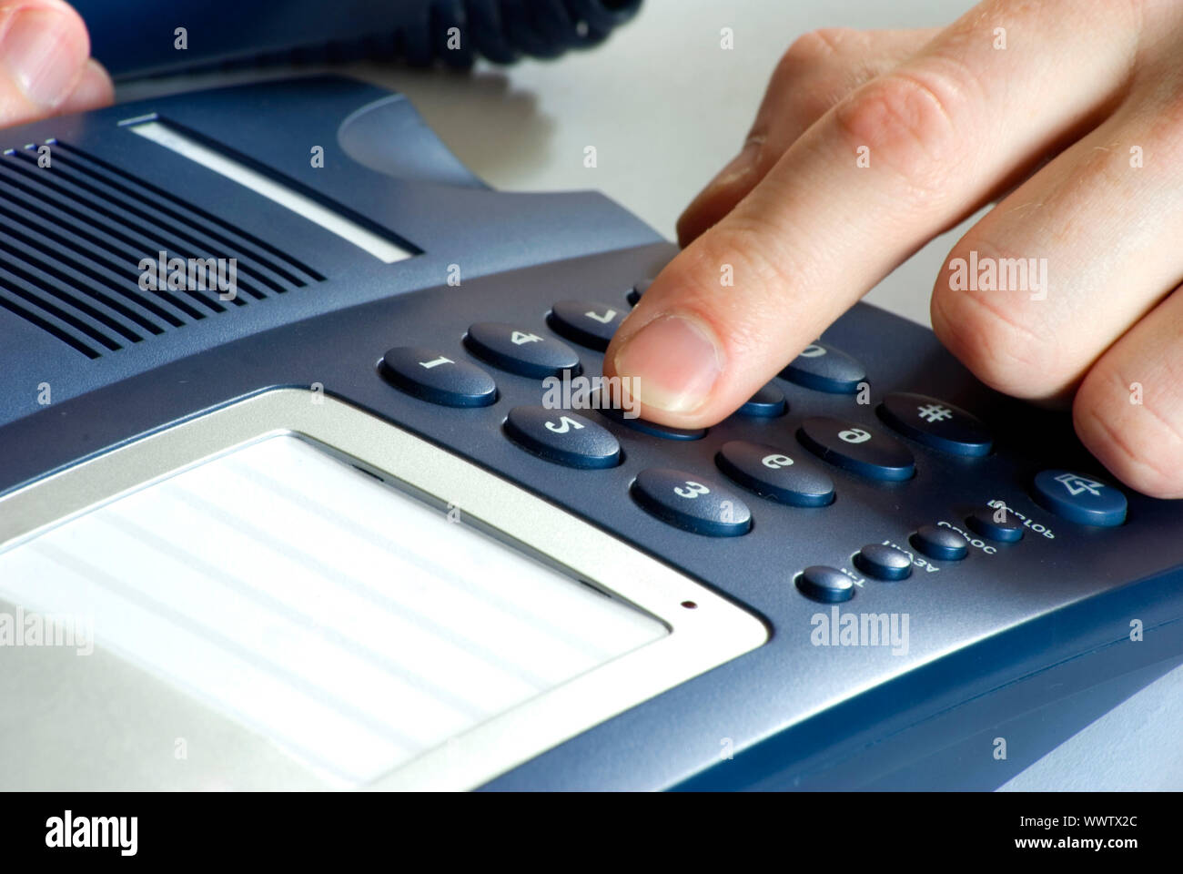 finger with blue telephone keypad Stock Photo - Alamy