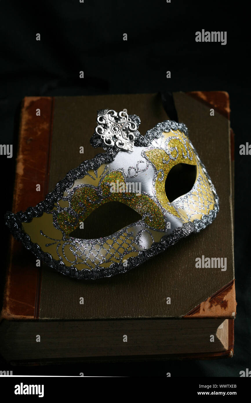 venetian mask on old book Stock Photo - Alamy