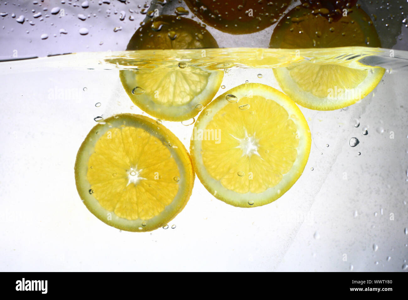 orange in ice cube frozen background Stock Photo - Alamy