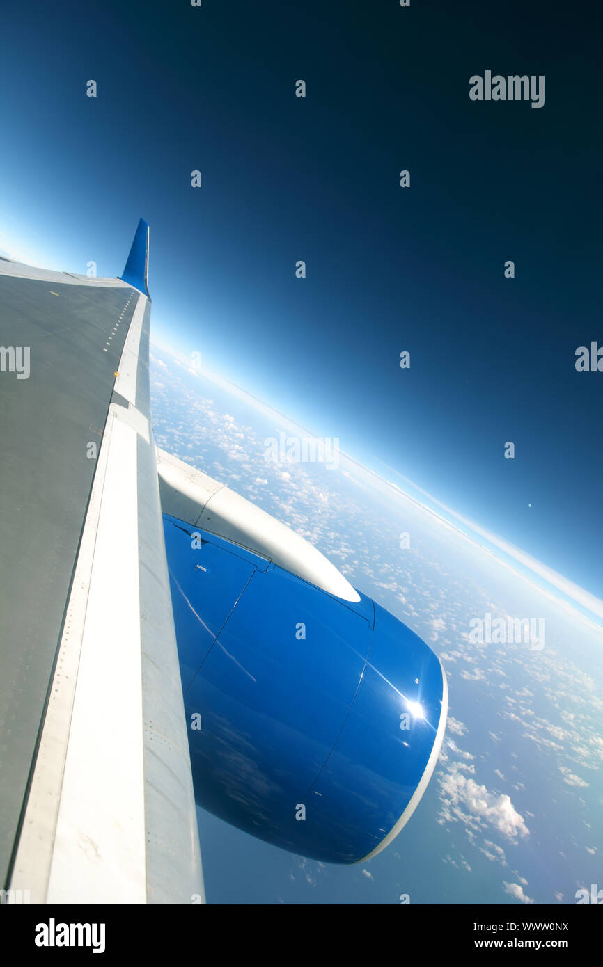 airplane fly in blue sky cloud around Stock Photo - Alamy
