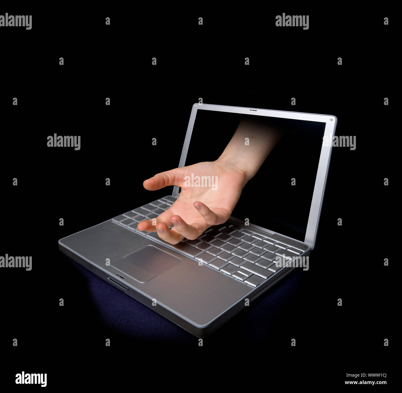 An open hand coming through a computer screen Stock Photo - Alamy