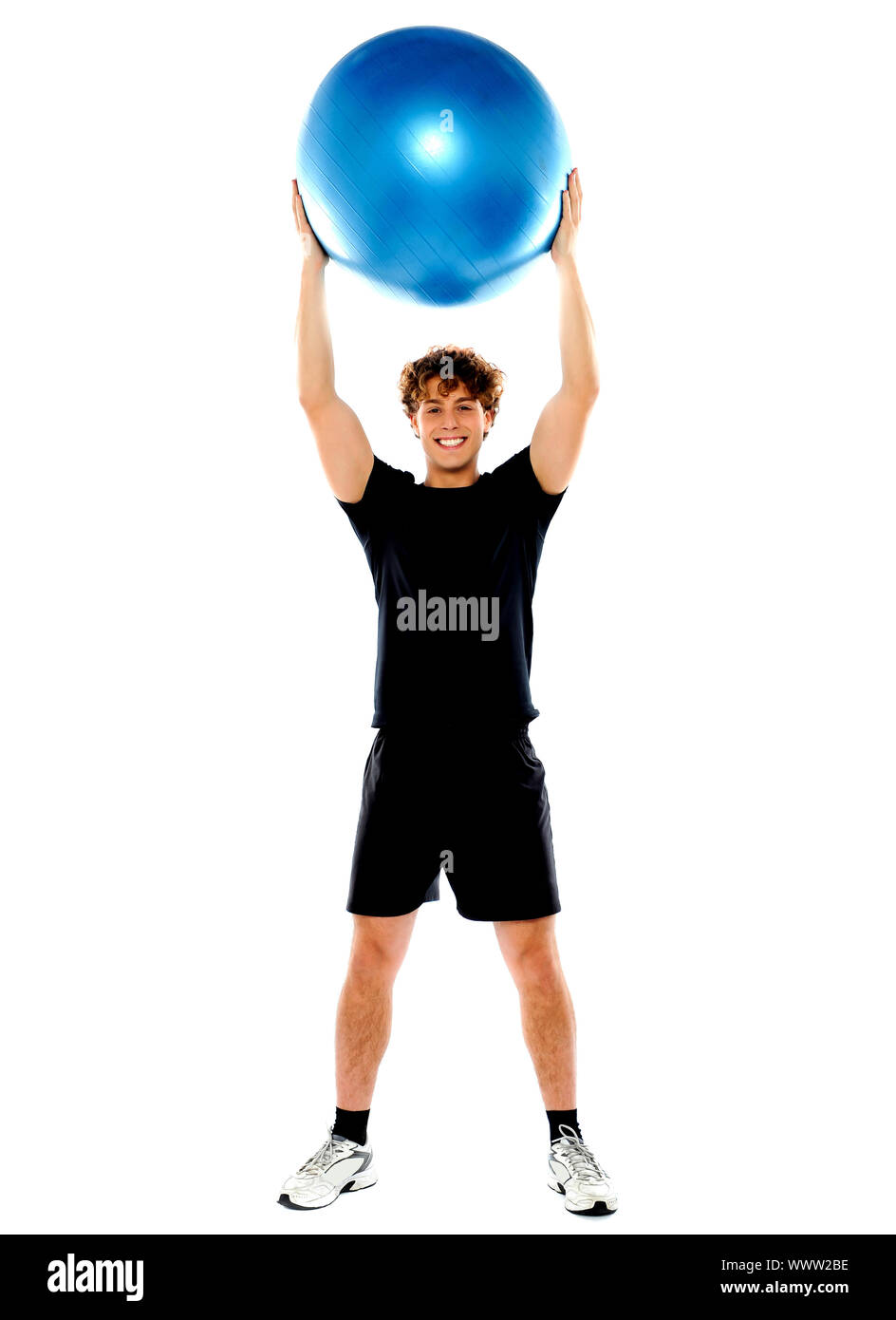 Man showing big ball over his head. Facing camera Stock Photo - Alamy