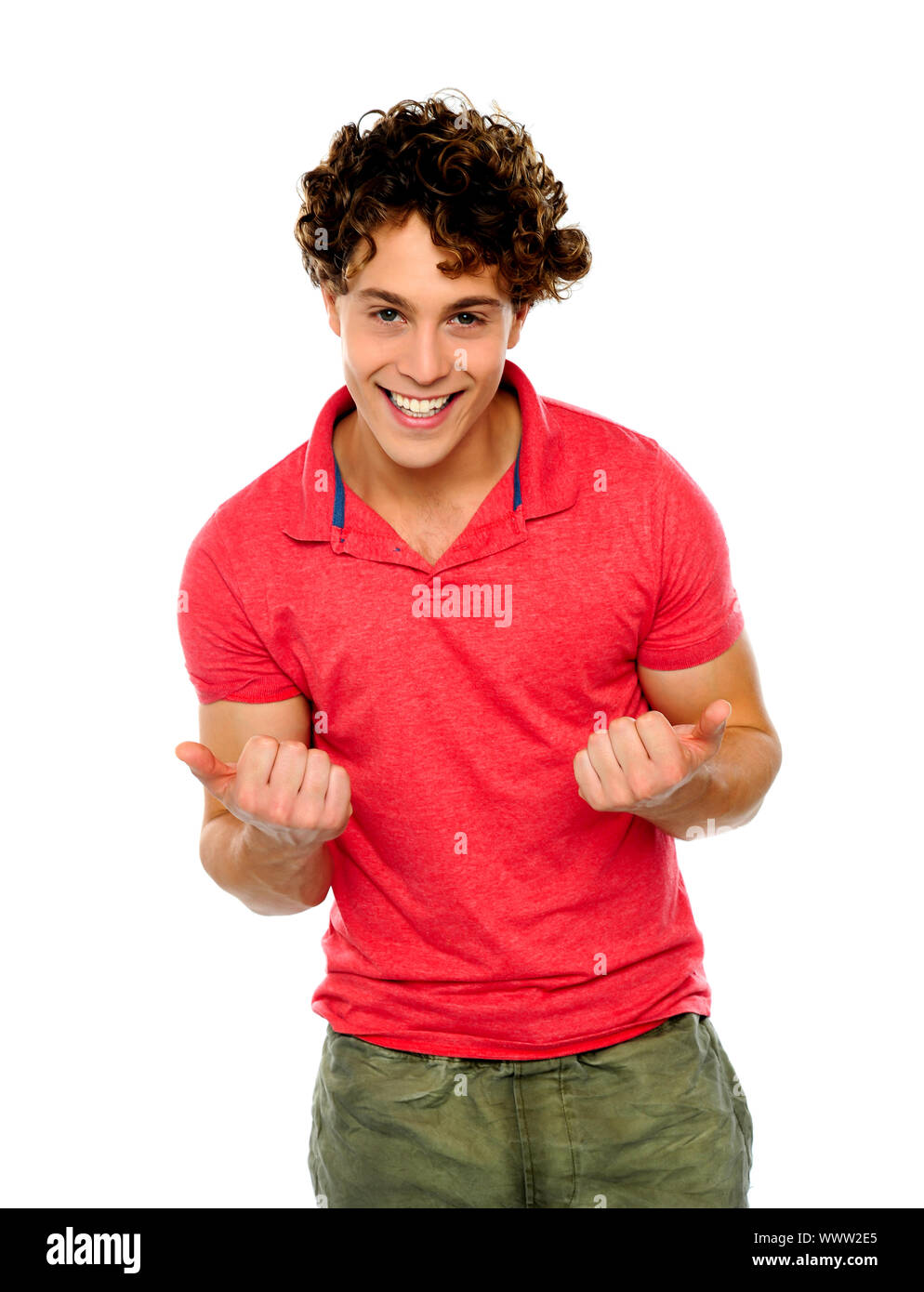 Excited young fellow posing right in front of camera Stock Photo - Alamy
