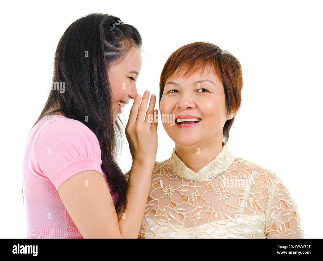 Young Asian daughter talking secretly to her mum Stock Photo - Alamy