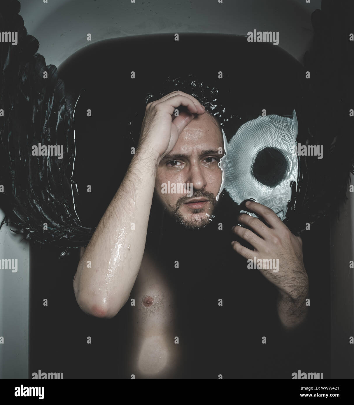 Legend, Fallen angel, man in a bathtub with black water and wings ...