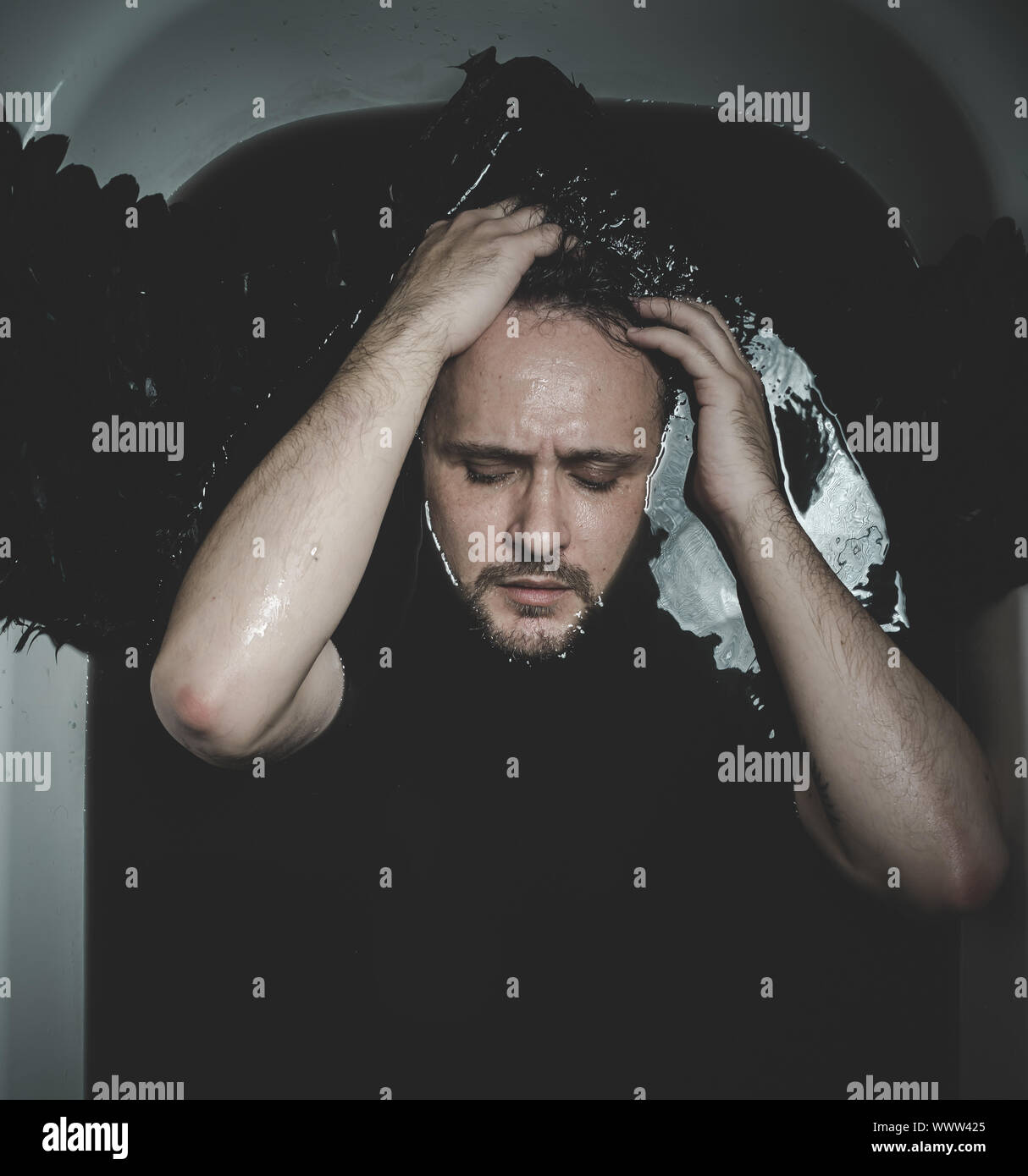 Heaven, Fallen angel, man in a bathtub with black water and wings ...
