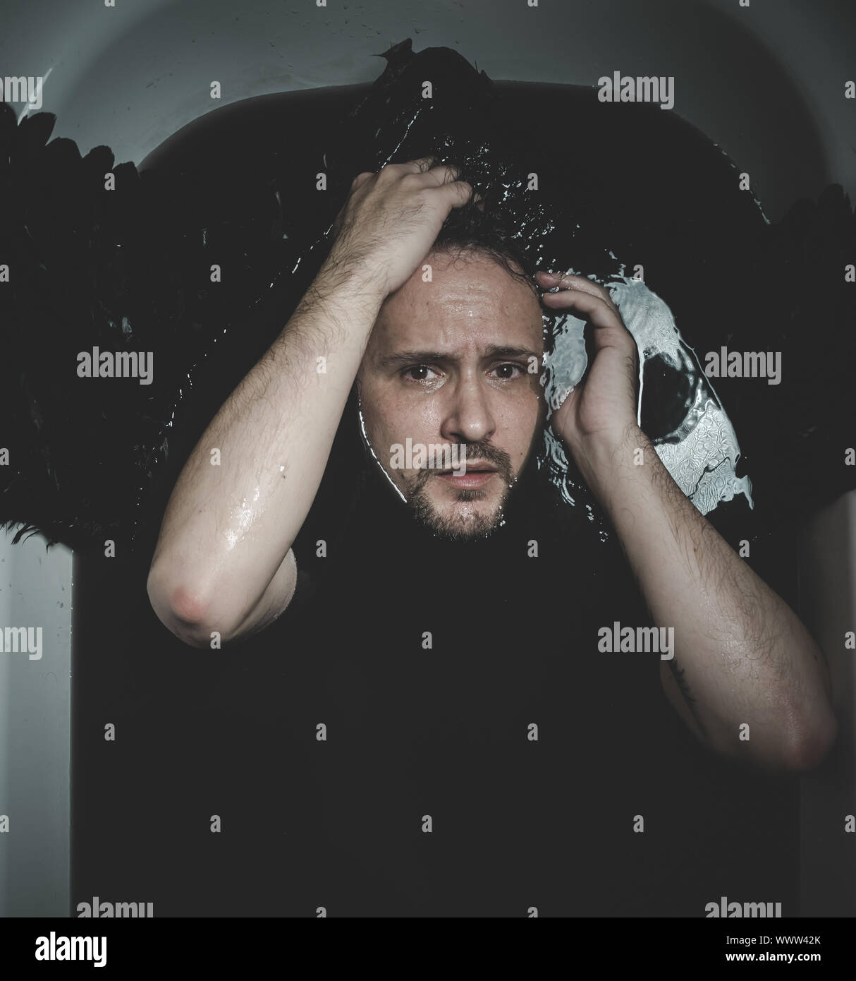 Evil, Fallen angel, man in a bathtub with black water and wings ...