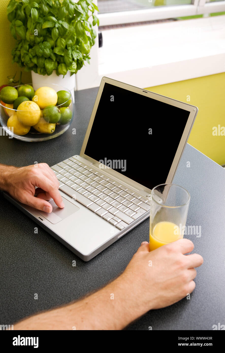 Indoor kitchen laptop lunch man hi-res stock photography and images - Alamy
