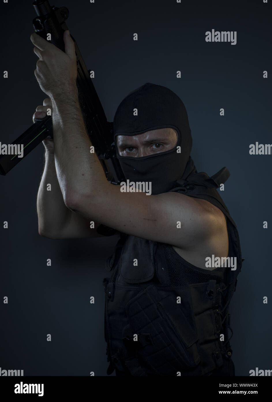 Criminal, Terrorist, a man dressed in a bulletproof vest and balaclava ...
