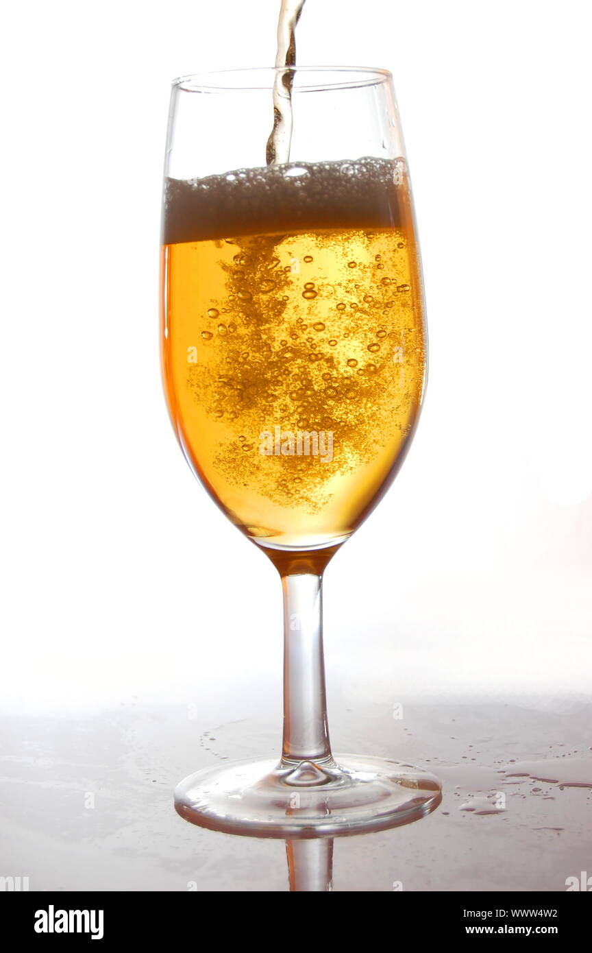 glass of fresh beer with bubbles on white Stock Photo - Alamy