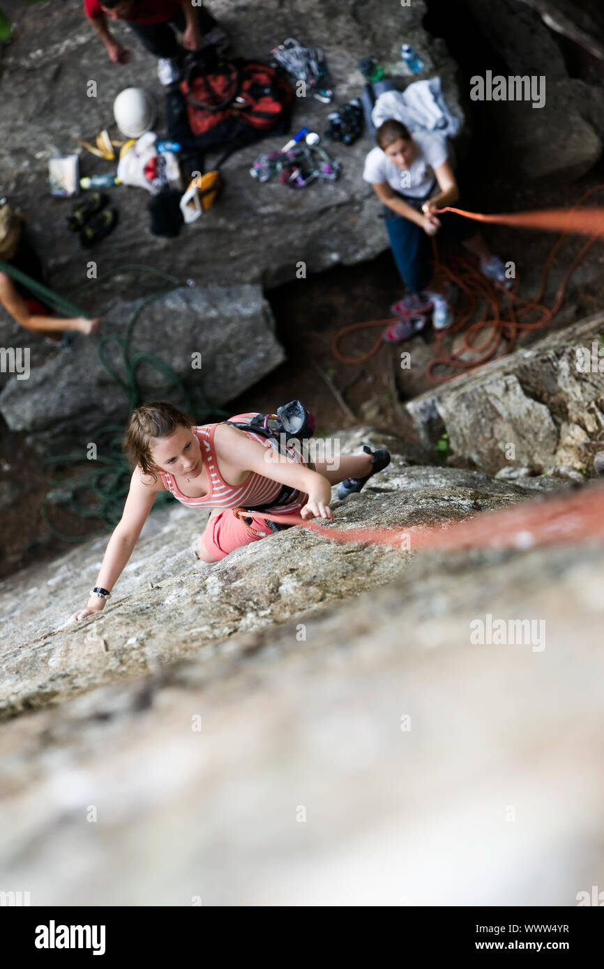 Female climber climbing the climbing wall hi-res stock photography and ...