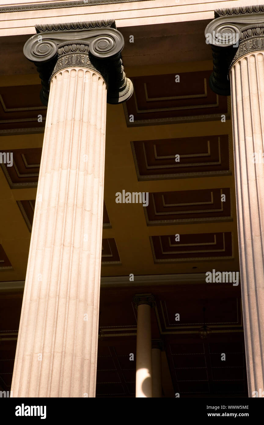 A detail of an old building built in the old Greek style with Ionic ...