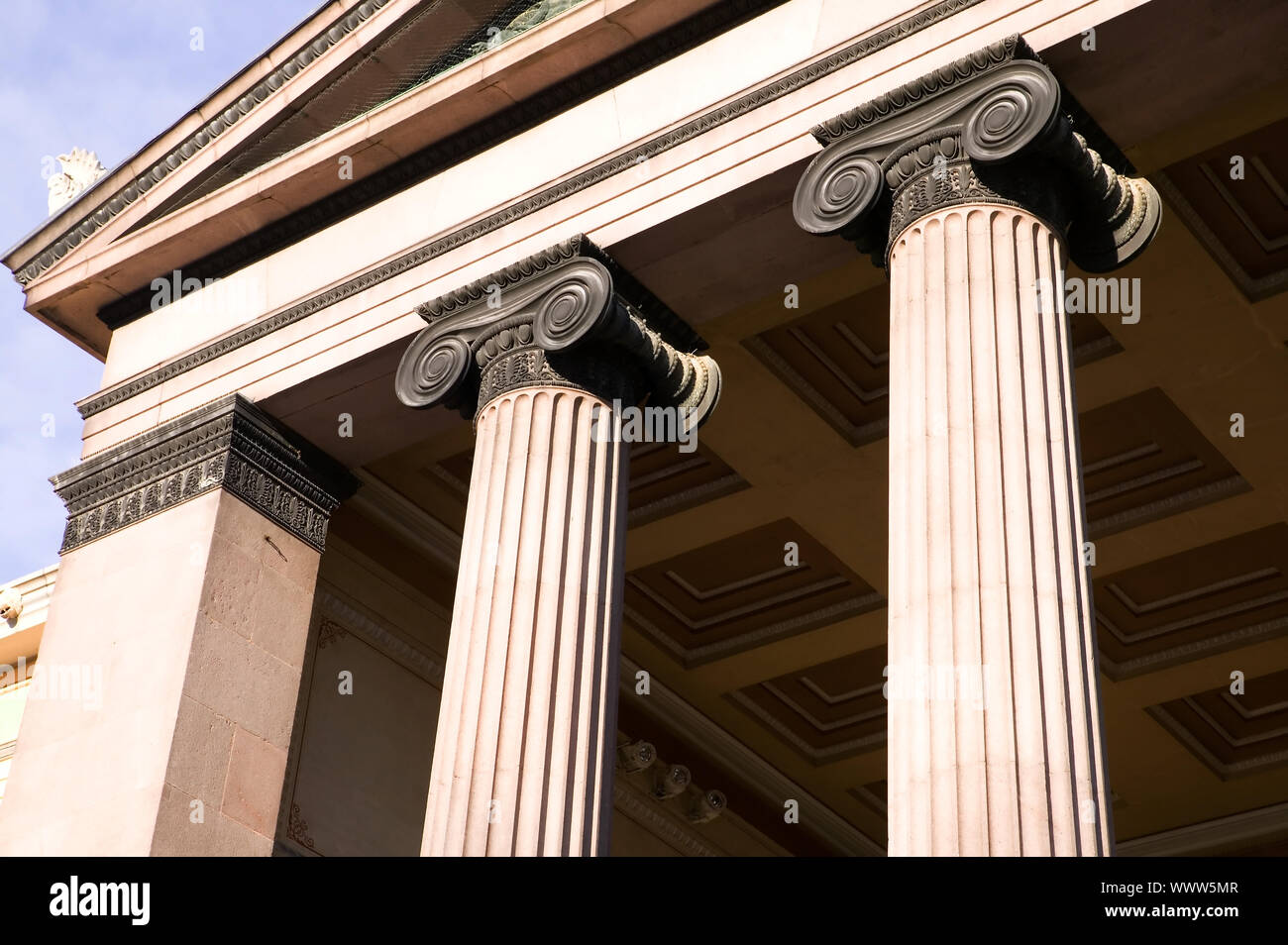 A detail of an old building built in the old Greek style with Ionic ...