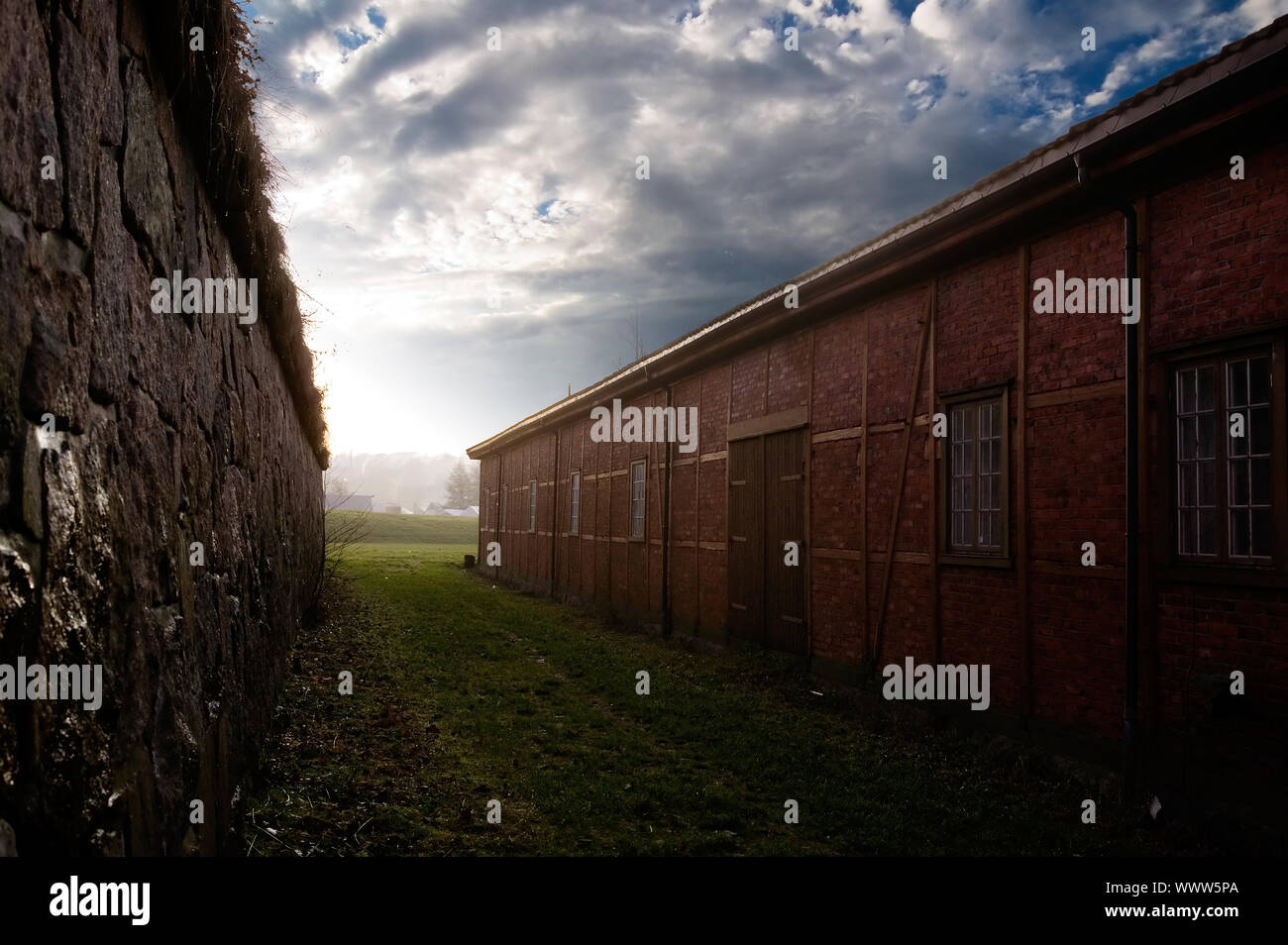 A small alleyway between two historical buildings leading out into ...