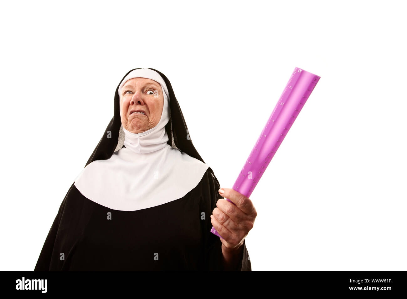 Angry senior nun weilding purple ruler as weapon Stock Photo - Alamy
