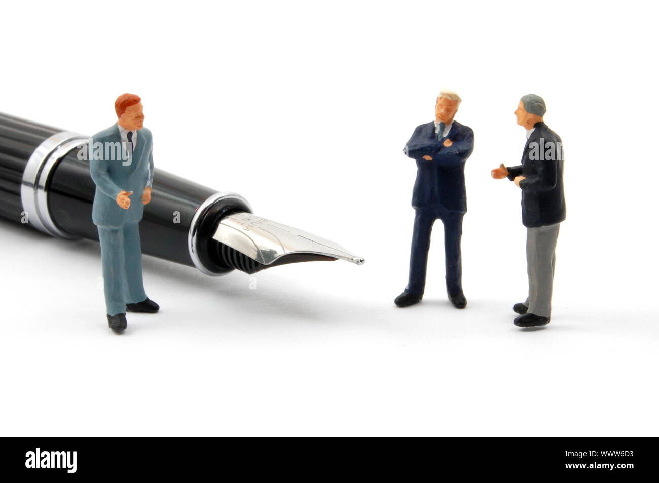 business man and pen isolated on white background Stock Photo - Alamy