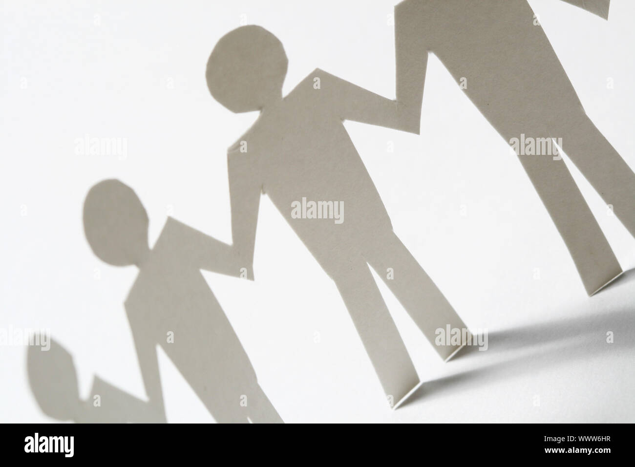 Group paper doll holding hands hi-res stock photography and images - Alamy