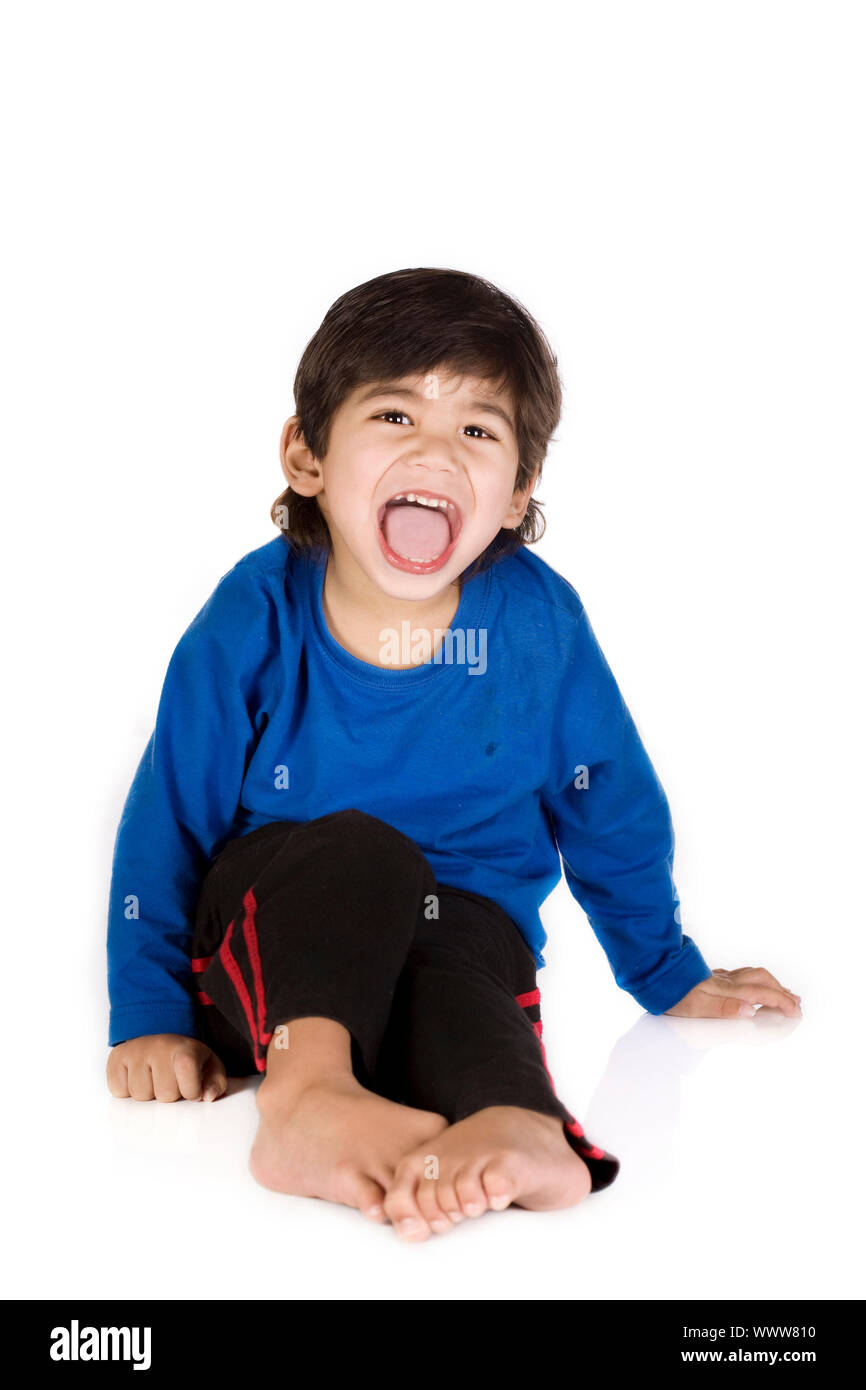 Little boy sitting, isolated Stock Photo - Alamy