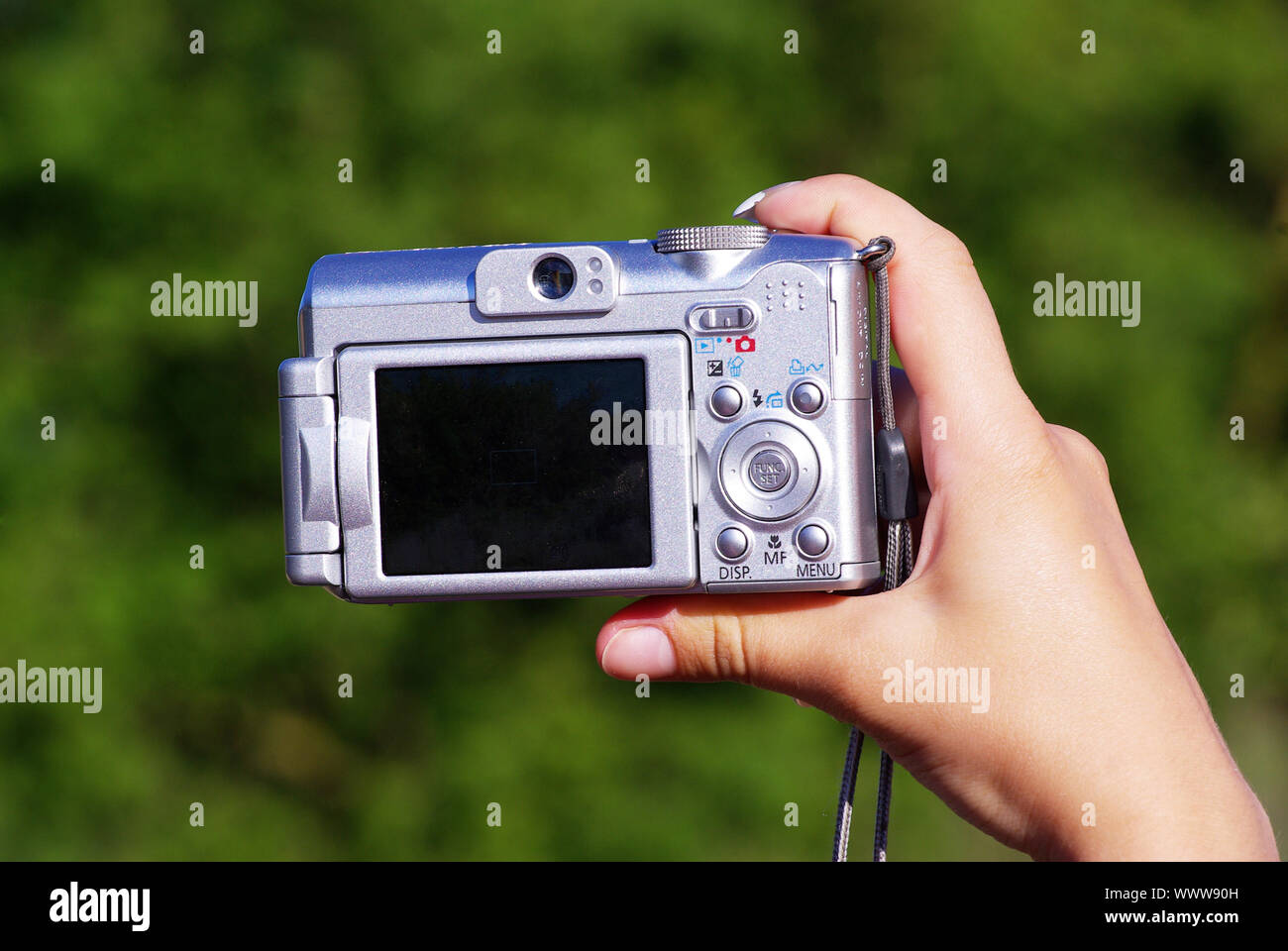 Digital camera in a hand Stock Photo - Alamy