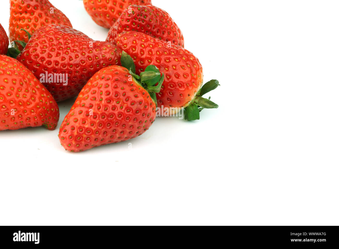 strawberry pile on white background Stock Photo - Alamy