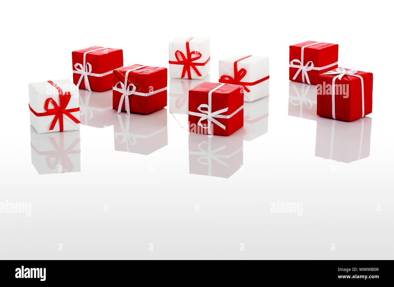 Christmas season! Small gift boxes with reflection Stock Photo - Alamy