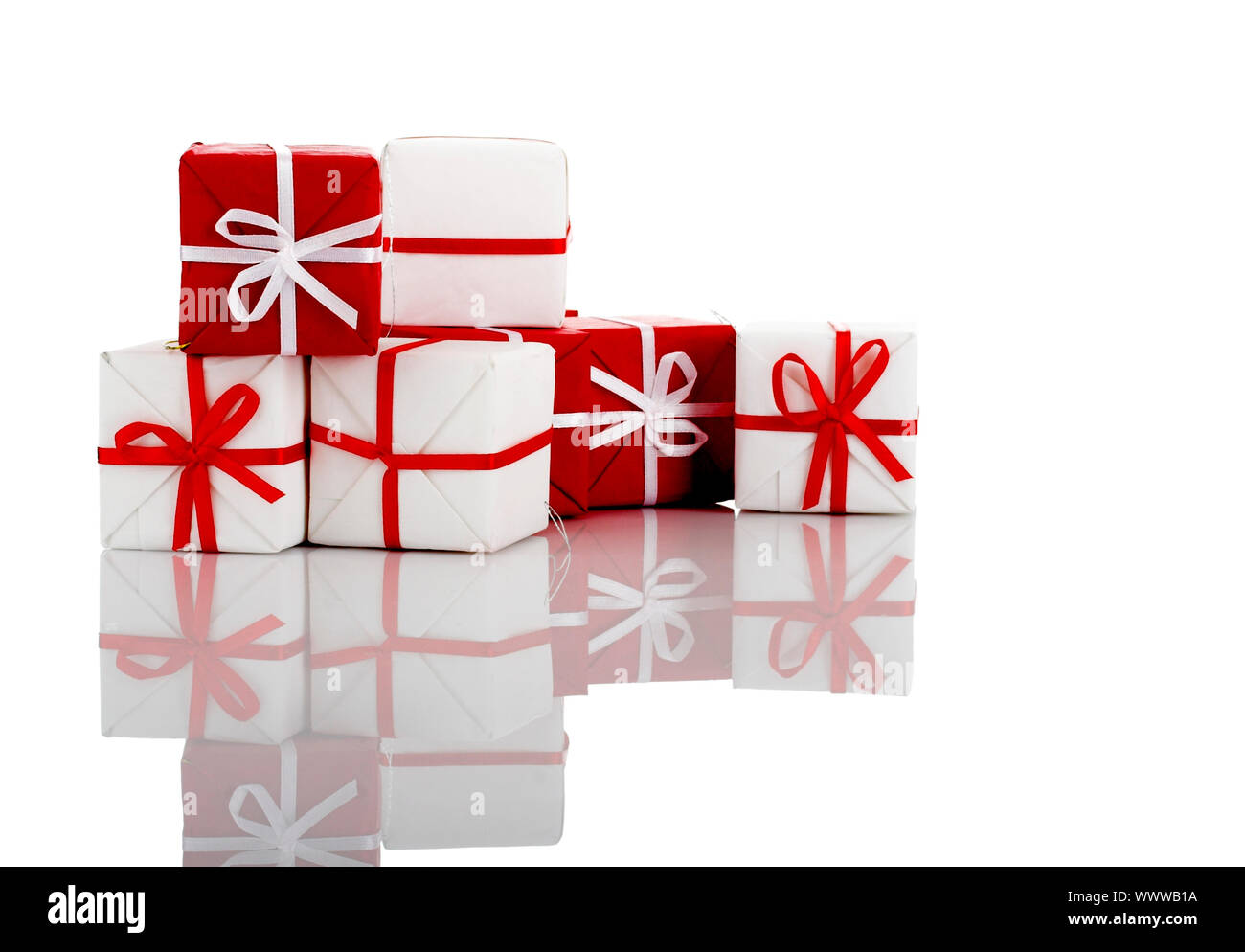 Christmas season! Small gift boxes with reflection Stock Photo - Alamy