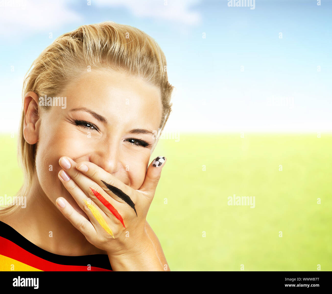 Portrait of a smiling football fan Stock Photo - Alamy