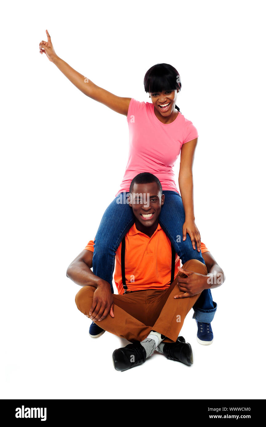 Couple having fun. Studio shot. All on white background Stock Photo - Alamy