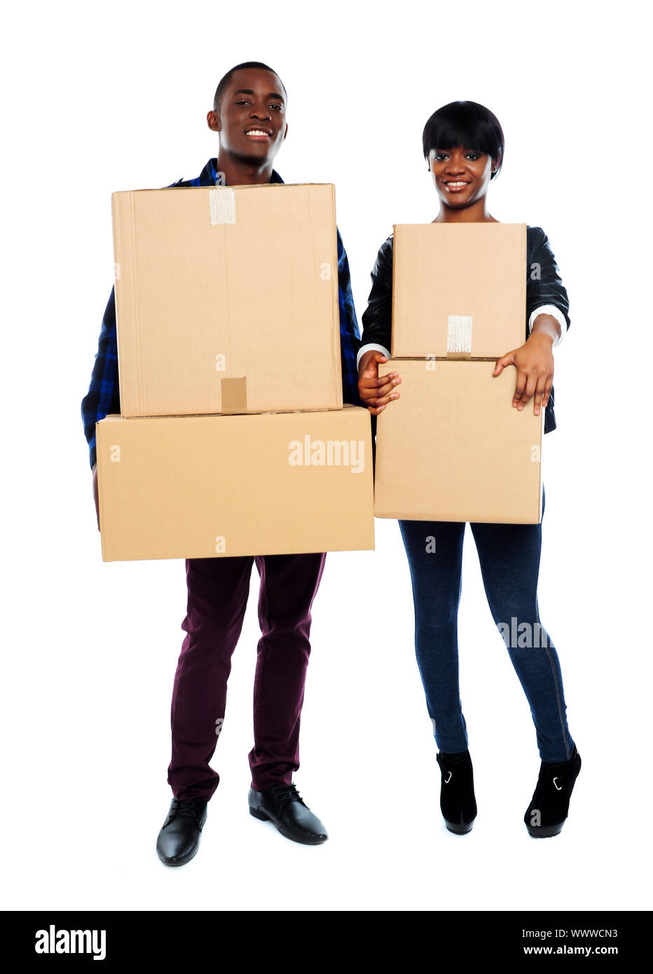 Smiling Young Couple Holding Cardboard Boxes Moving To A New Place