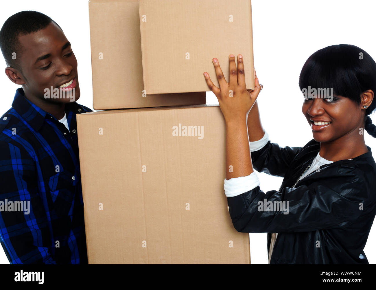 Pretty woman placing boxes on large stack. Man holding all Stock Photo ...