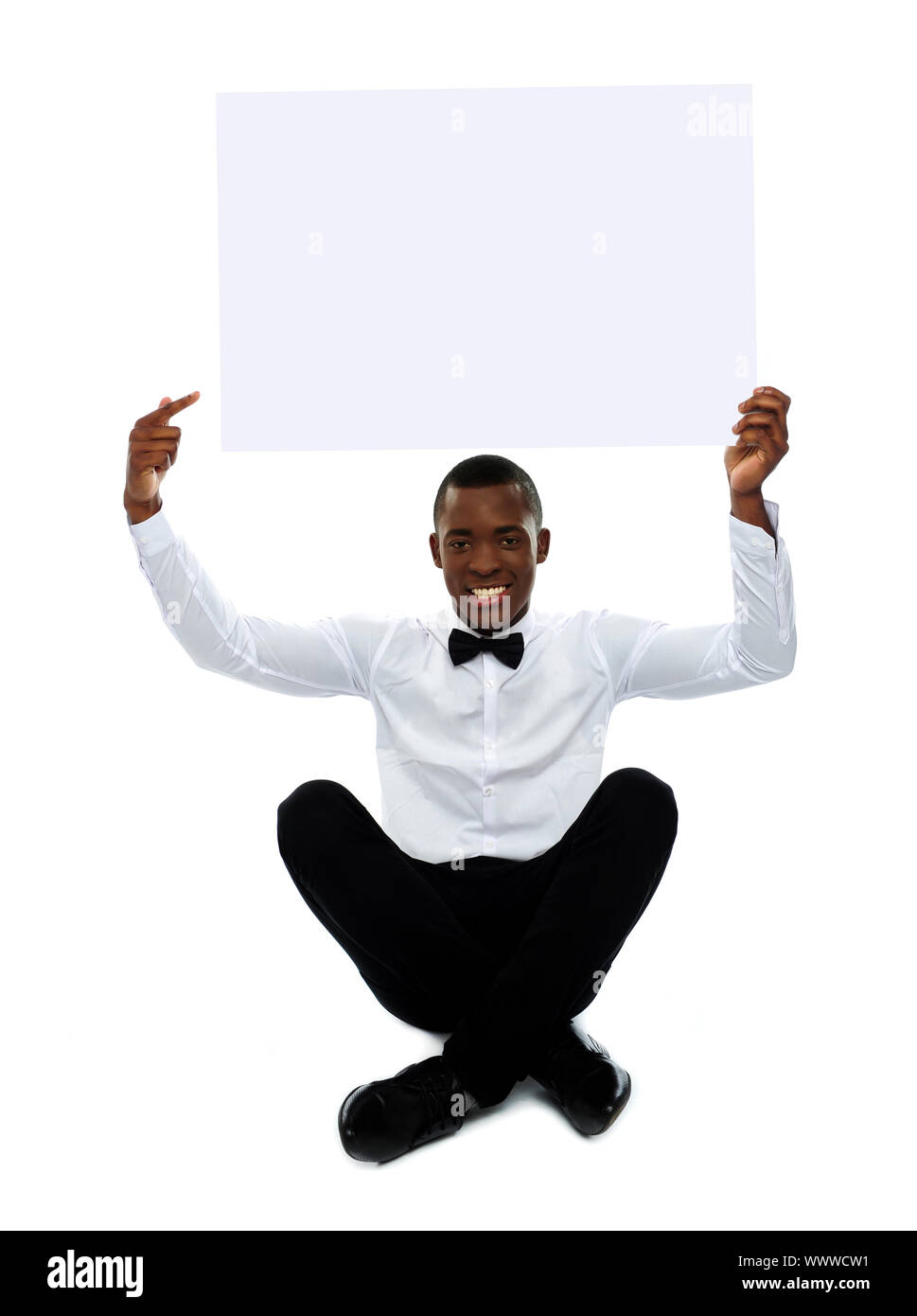 Seated black man pointing towards blank billboard over his head Stock ...