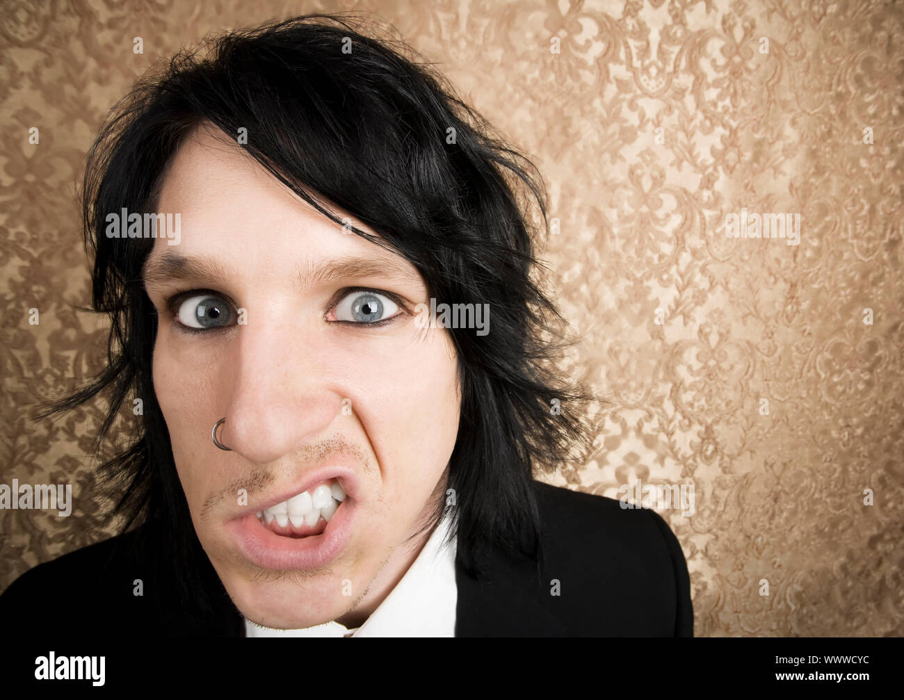 Wide angle closeup of a handsome angry man Stock Photo - Alamy