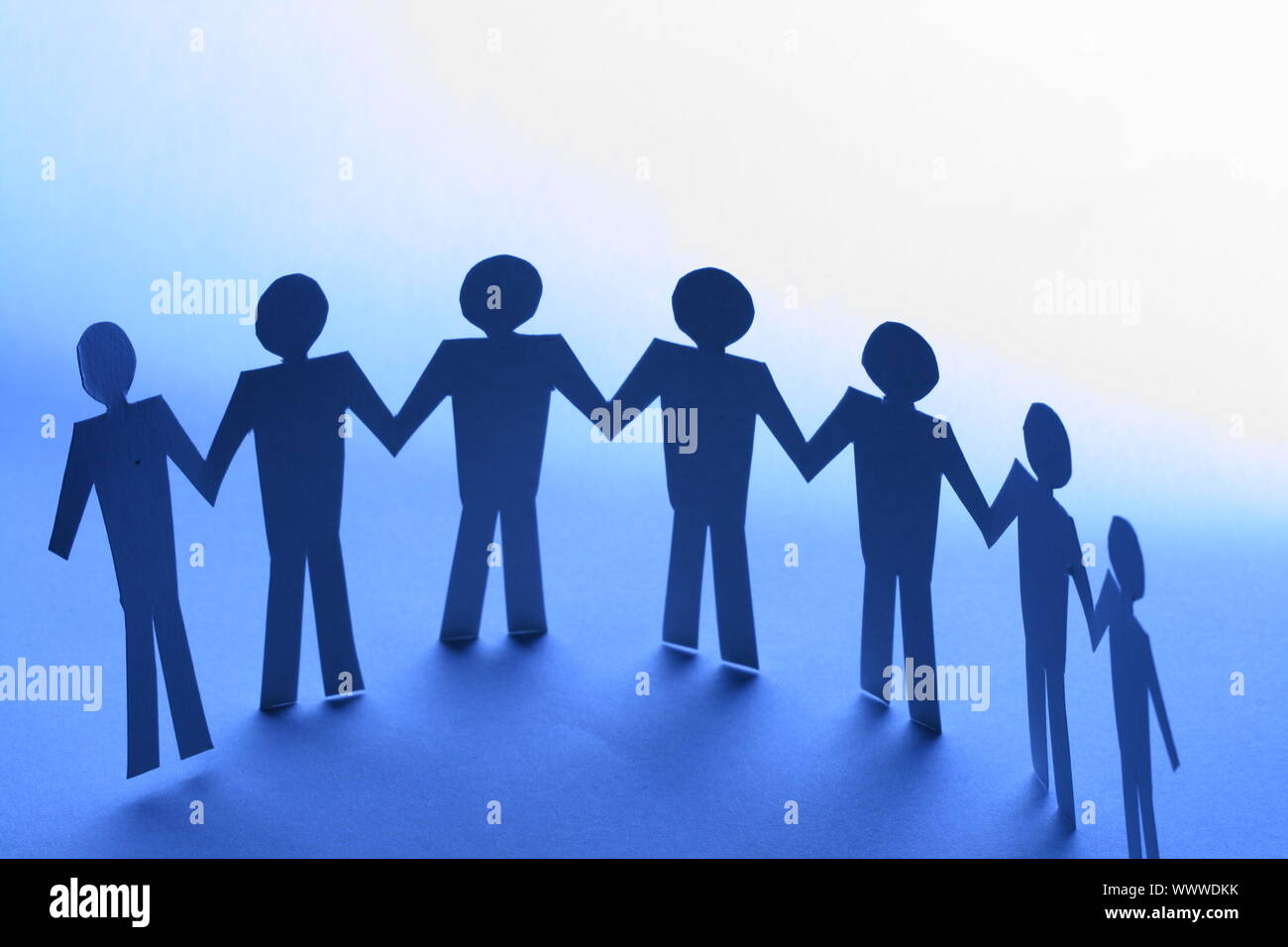 paper team linked together partnership concept Stock Photo - Alamy