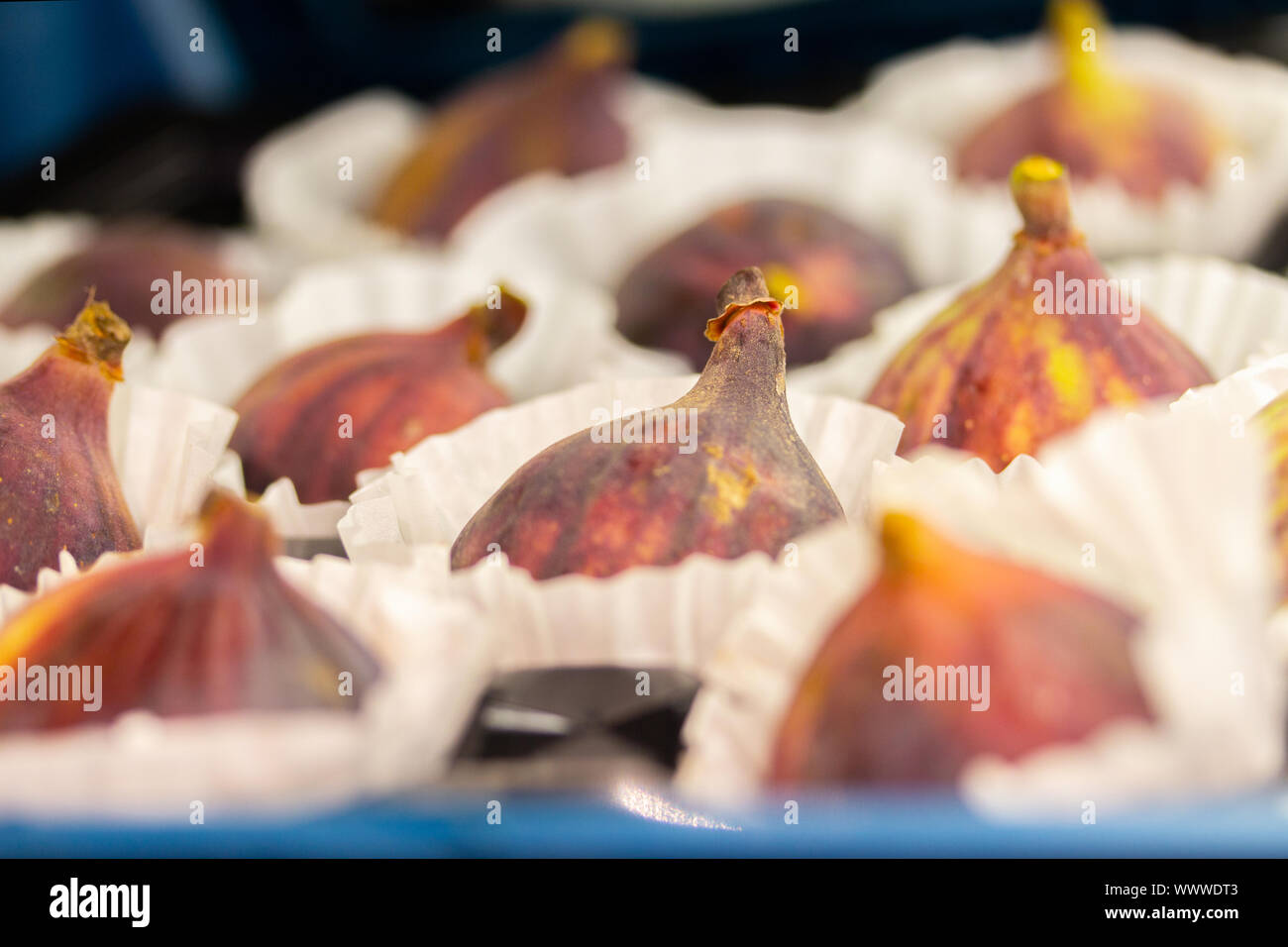 Sweet ripe figs in individual packaging, fruit background horizontal ...