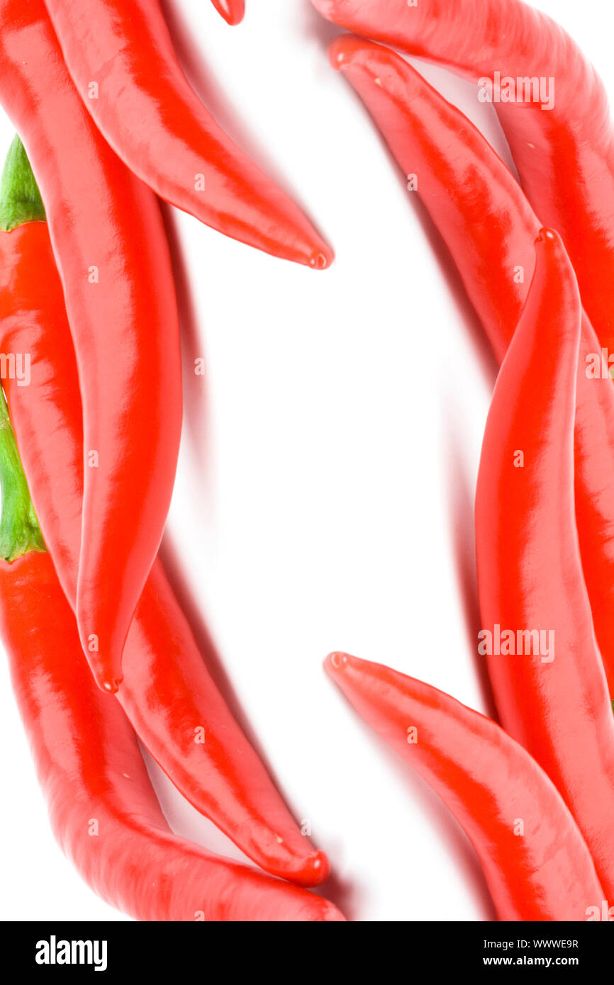 red chili peppers frame closeup on white background Stock Photo - Alamy