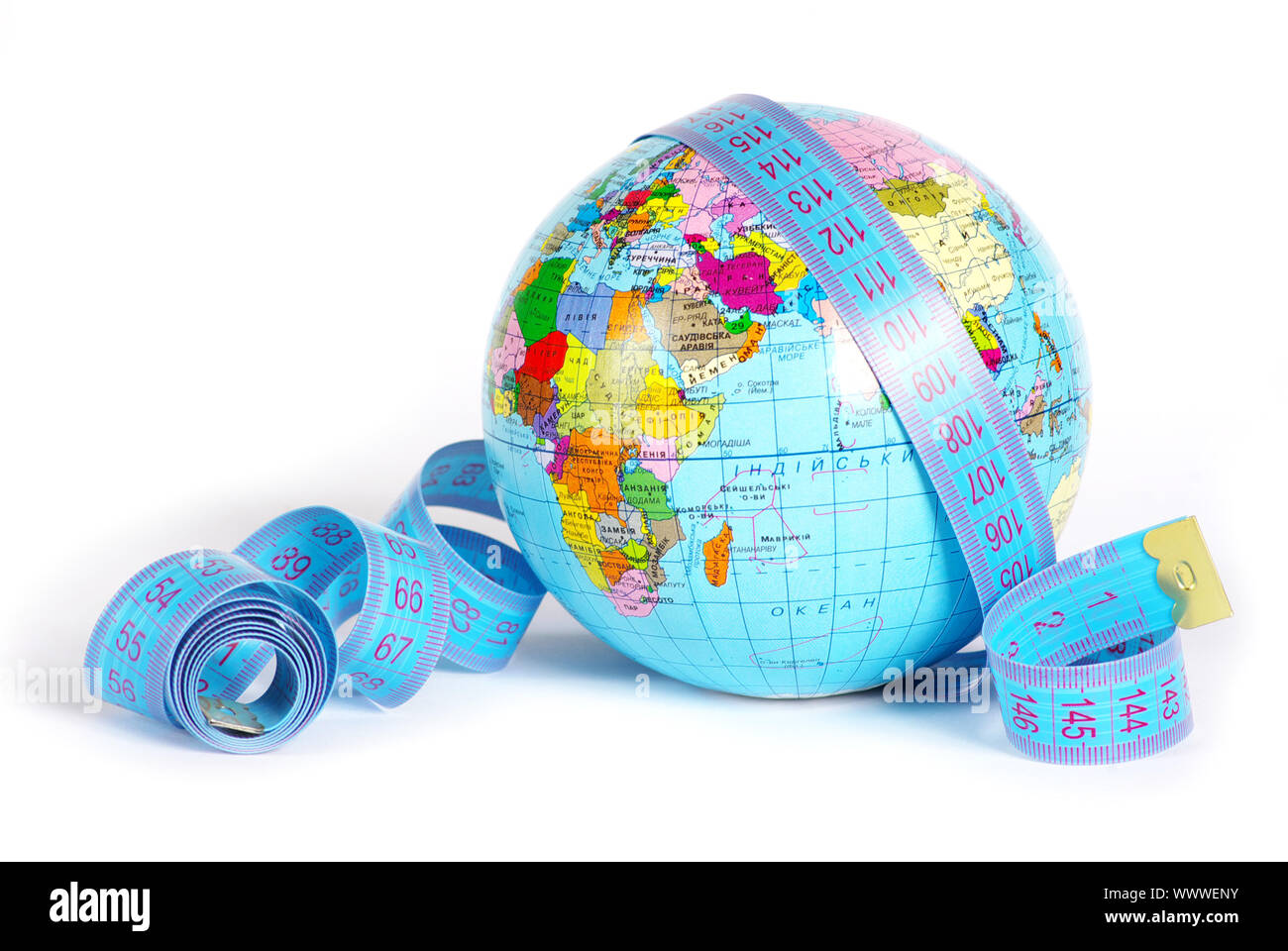 Measuring tape stretched across globe on white Stock Photo - Alamy