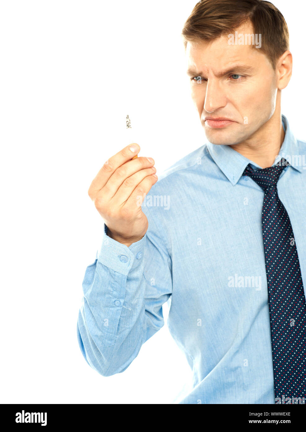 Angry smoker staring at cigarette isolated against white background ...