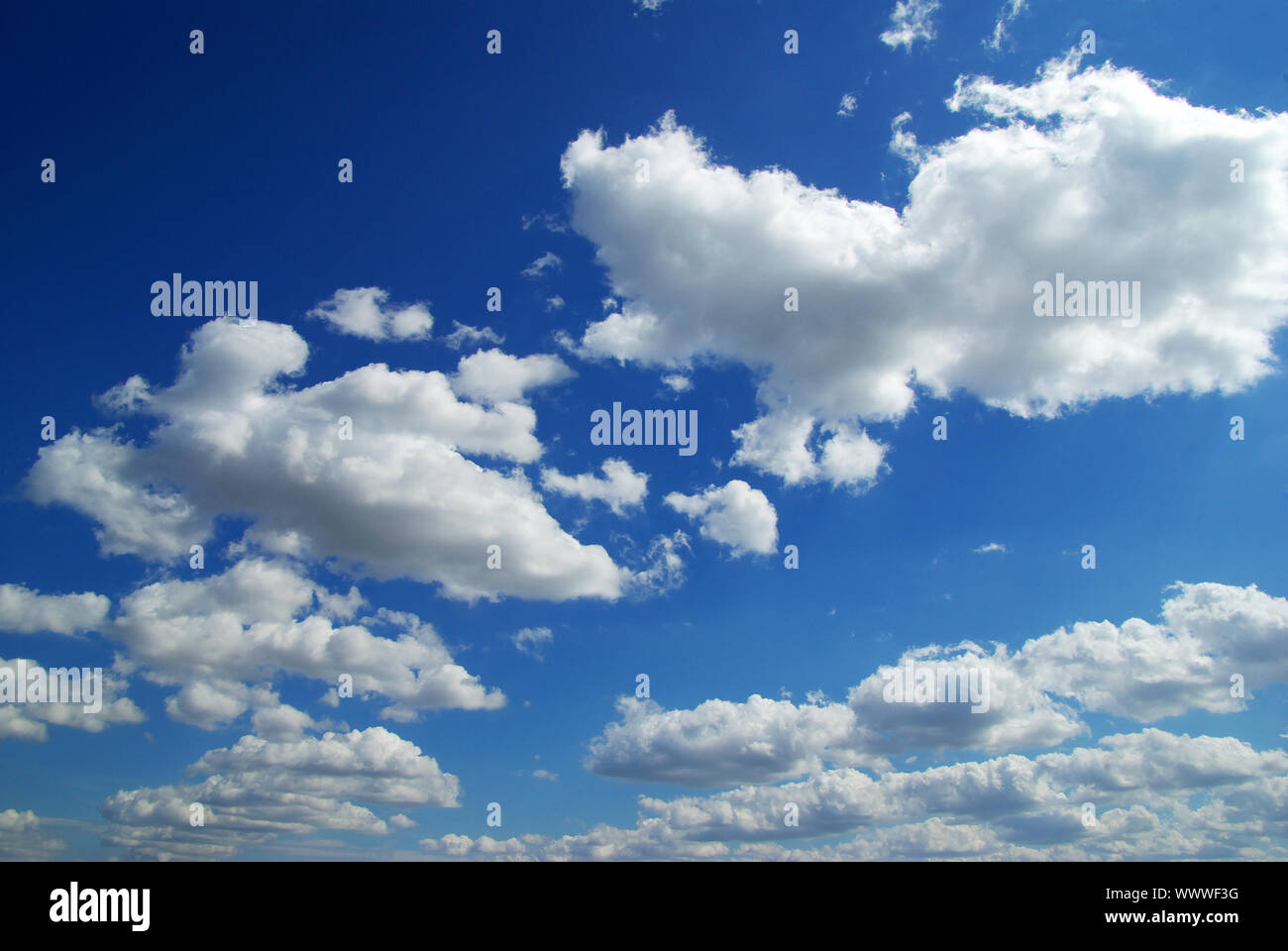 Blue sky background with tiny clouds Stock Photo - Alamy