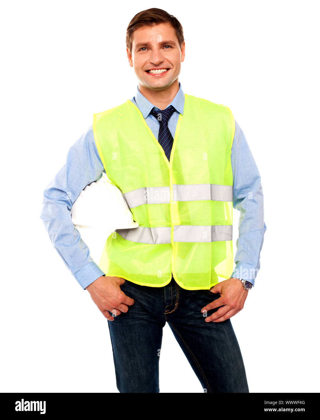 Smiling architect posing with hard hat beside his waist against white ...