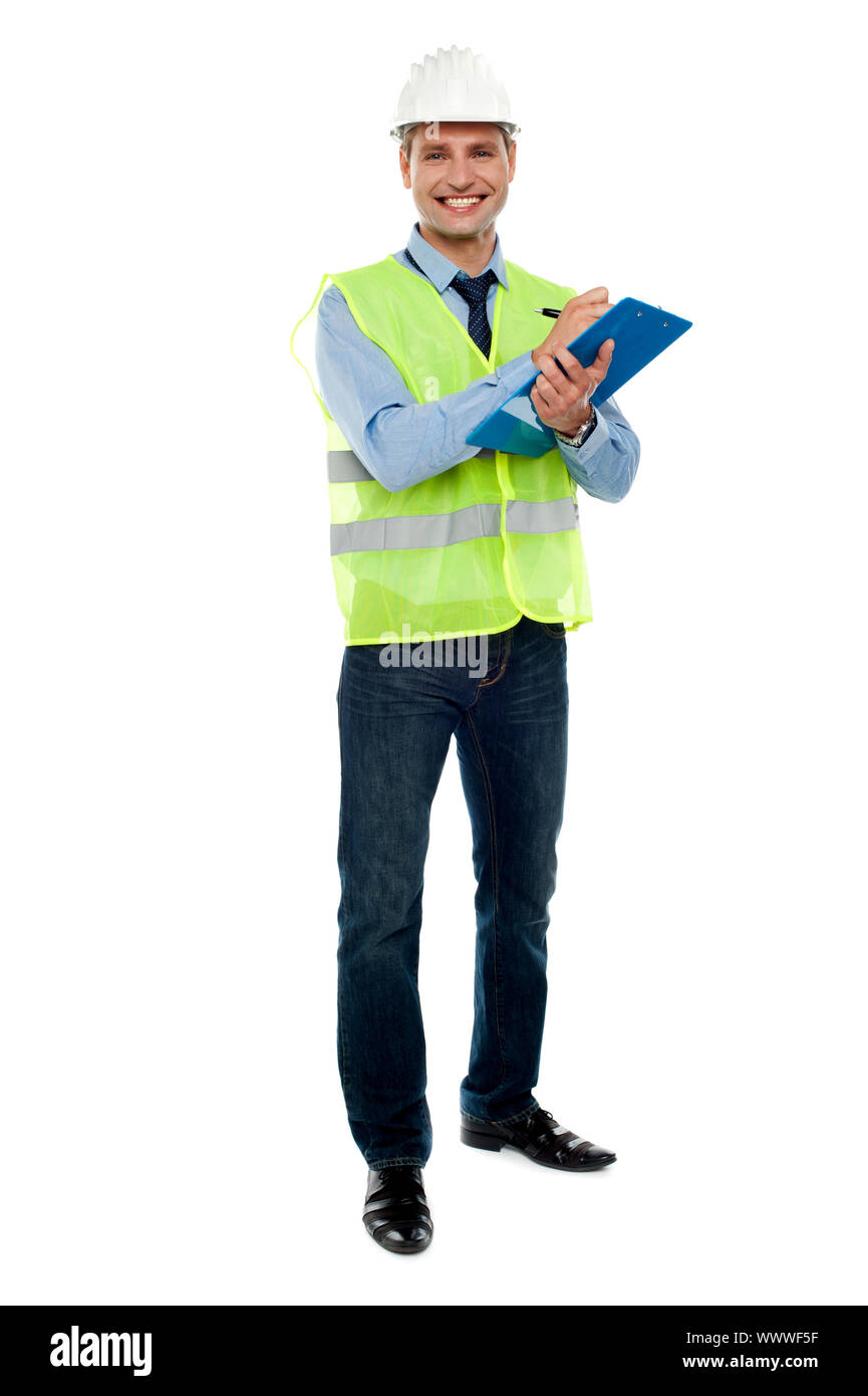 Full length portrait of handsome architect writing key notes on ...