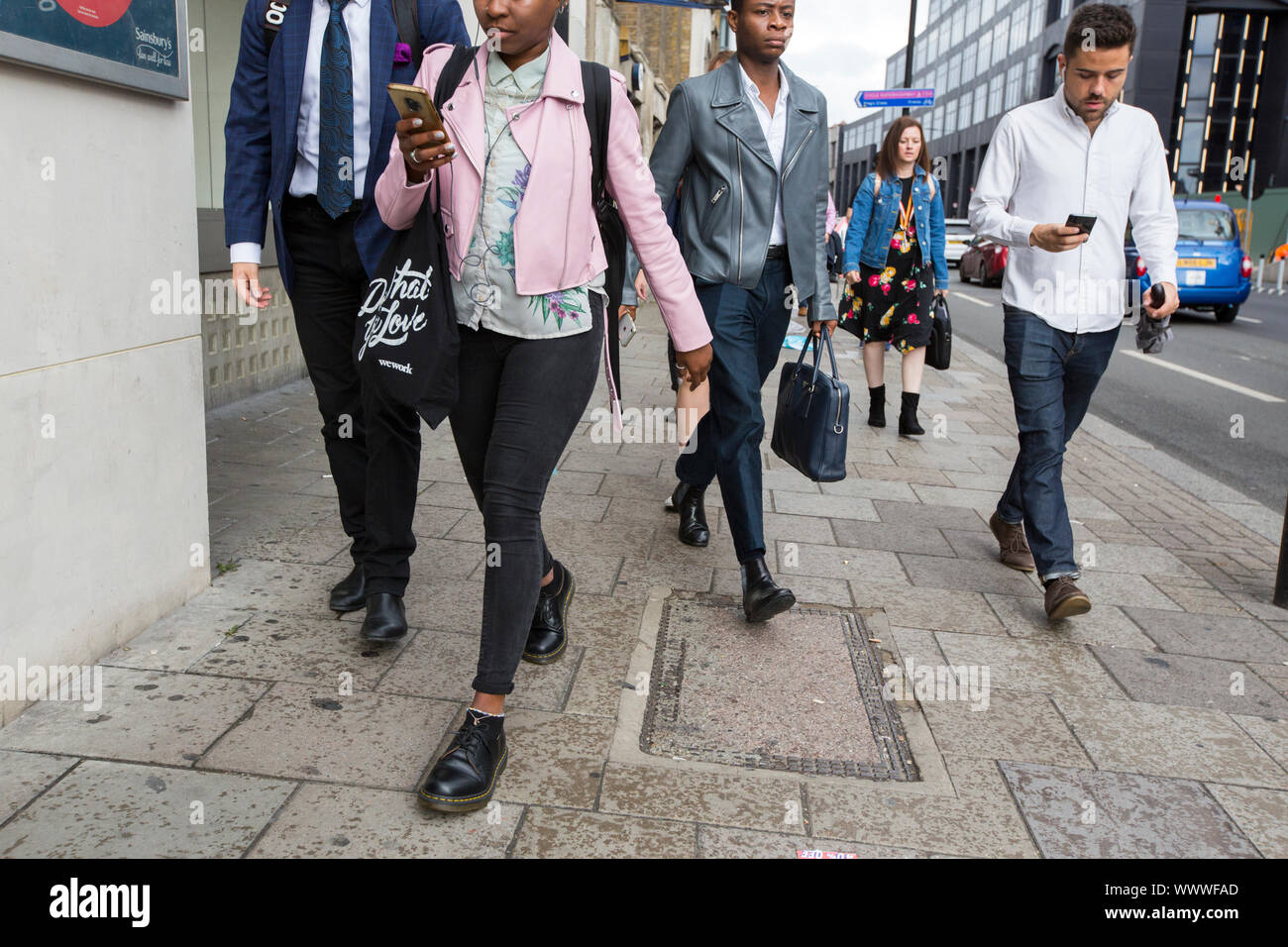Pedestrians using mobile phones hi-res stock photography and images - Alamy
