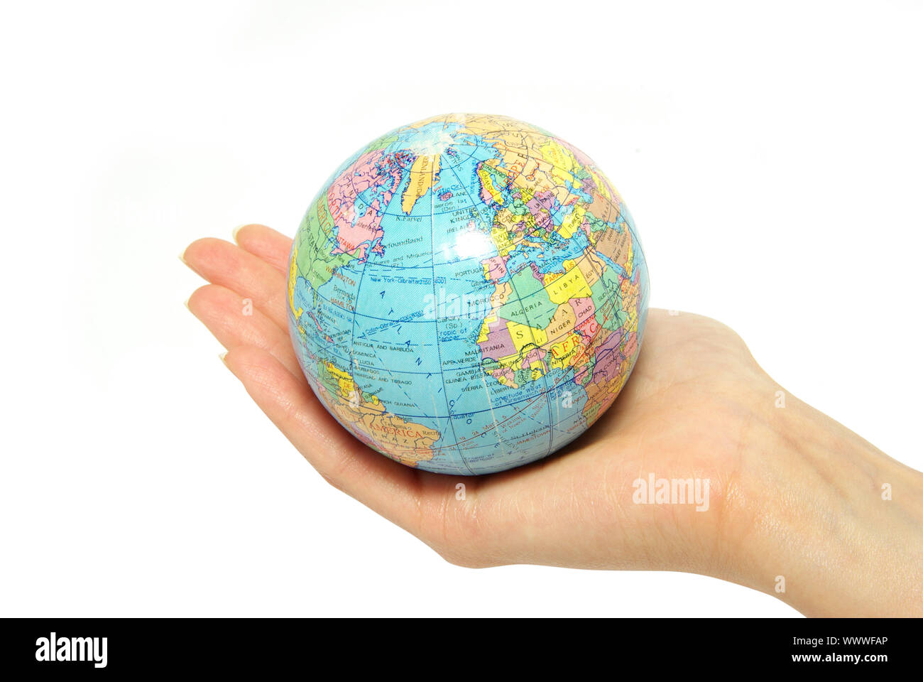Hand holdings a globe on a white Stock Photo - Alamy