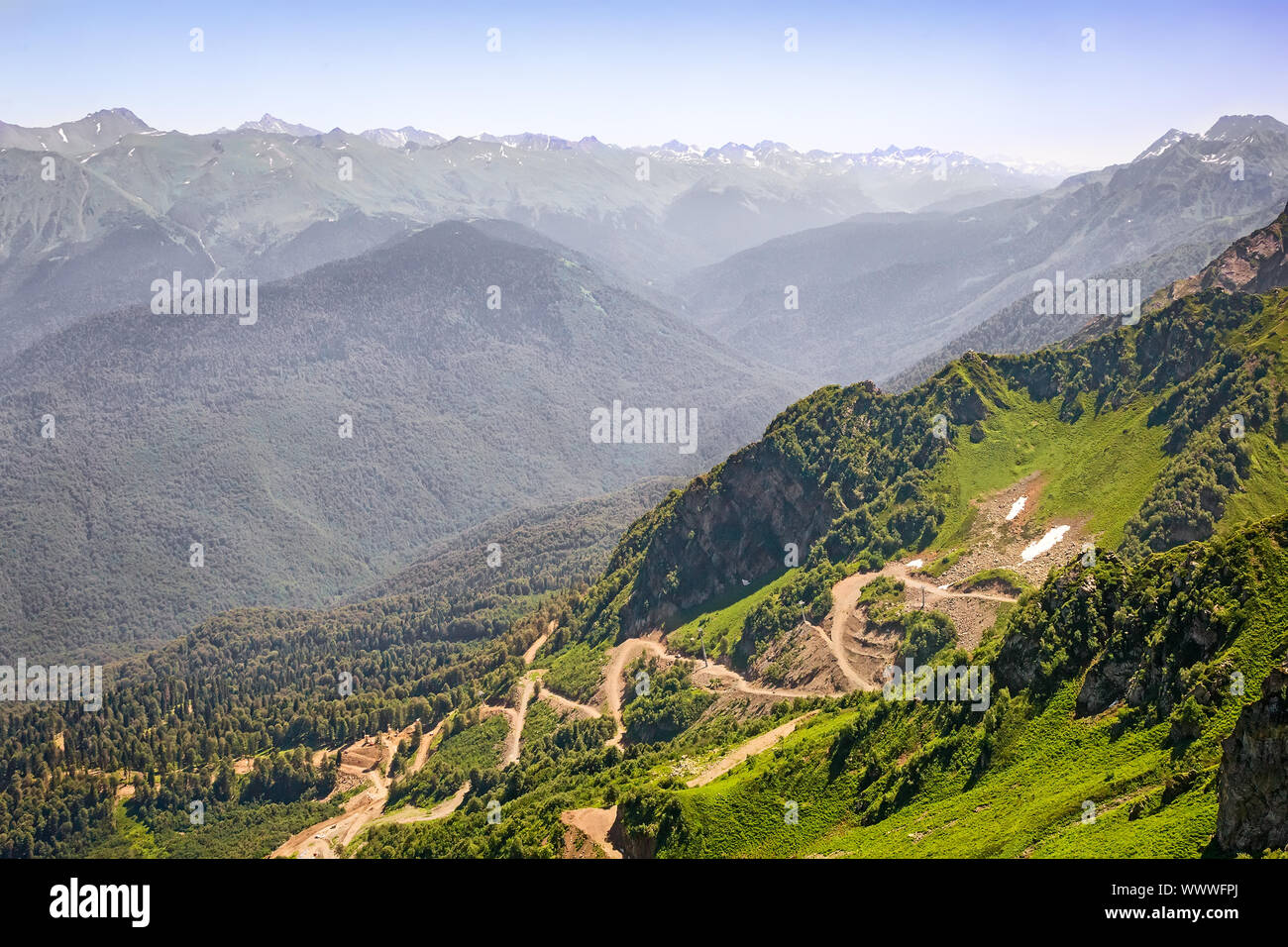Mountain landscape: a winding road on the mountainside Stock Photo - Alamy