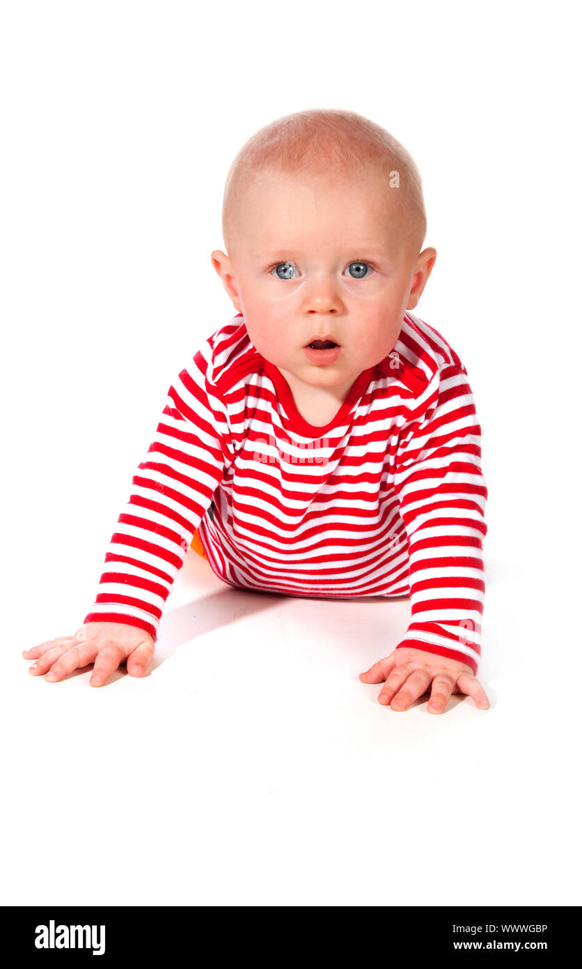 Surprisingly looking baby in red and white stripes Stock Photo - Alamy