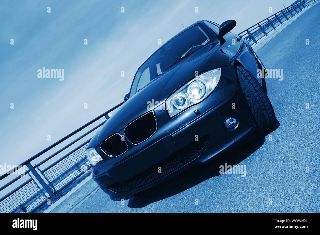 new blue and fast car on the road Stock Photo - Alamy
