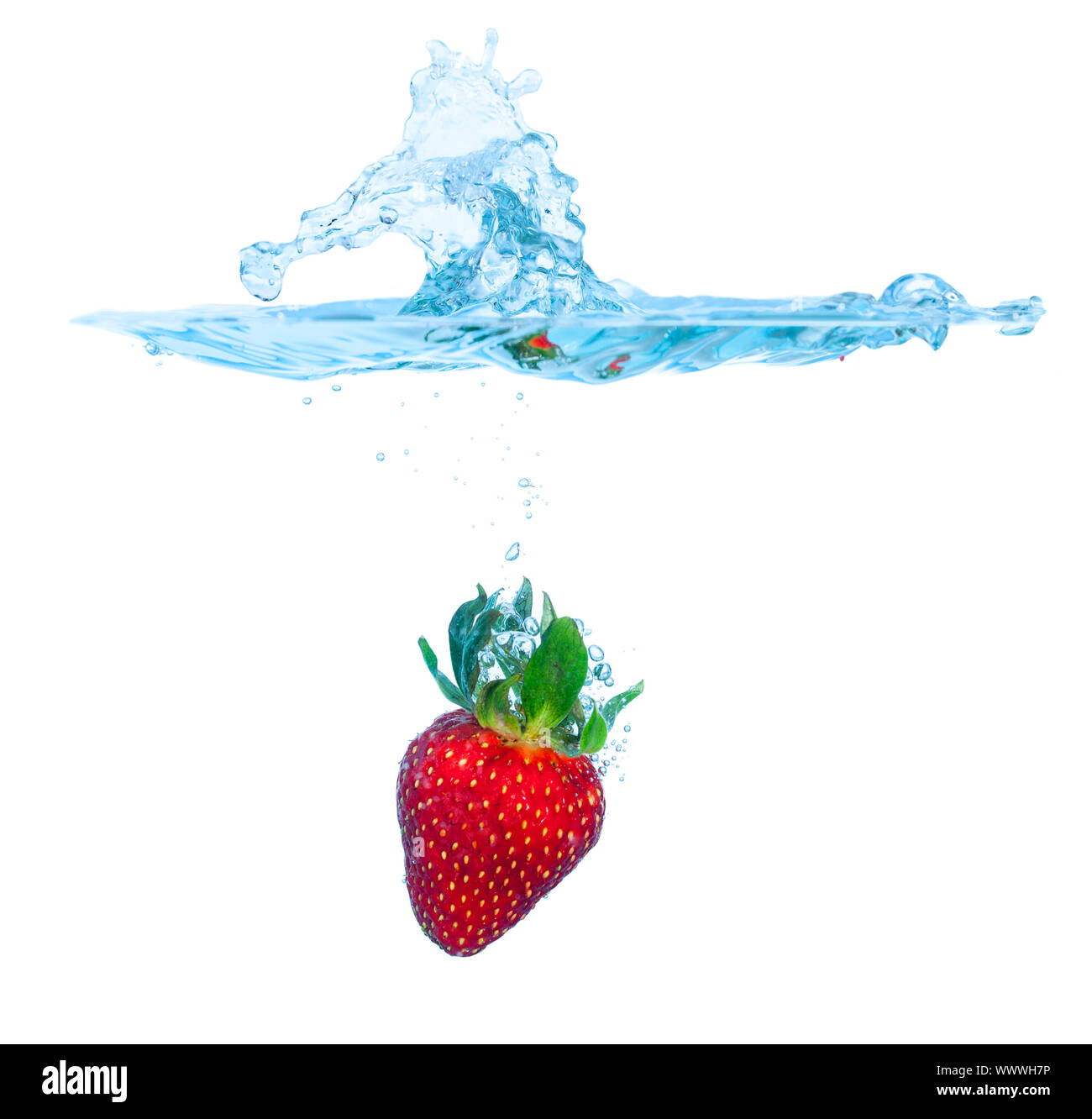 Fresh Strawberry Dropped into Water with Splash Stock Photo - Alamy