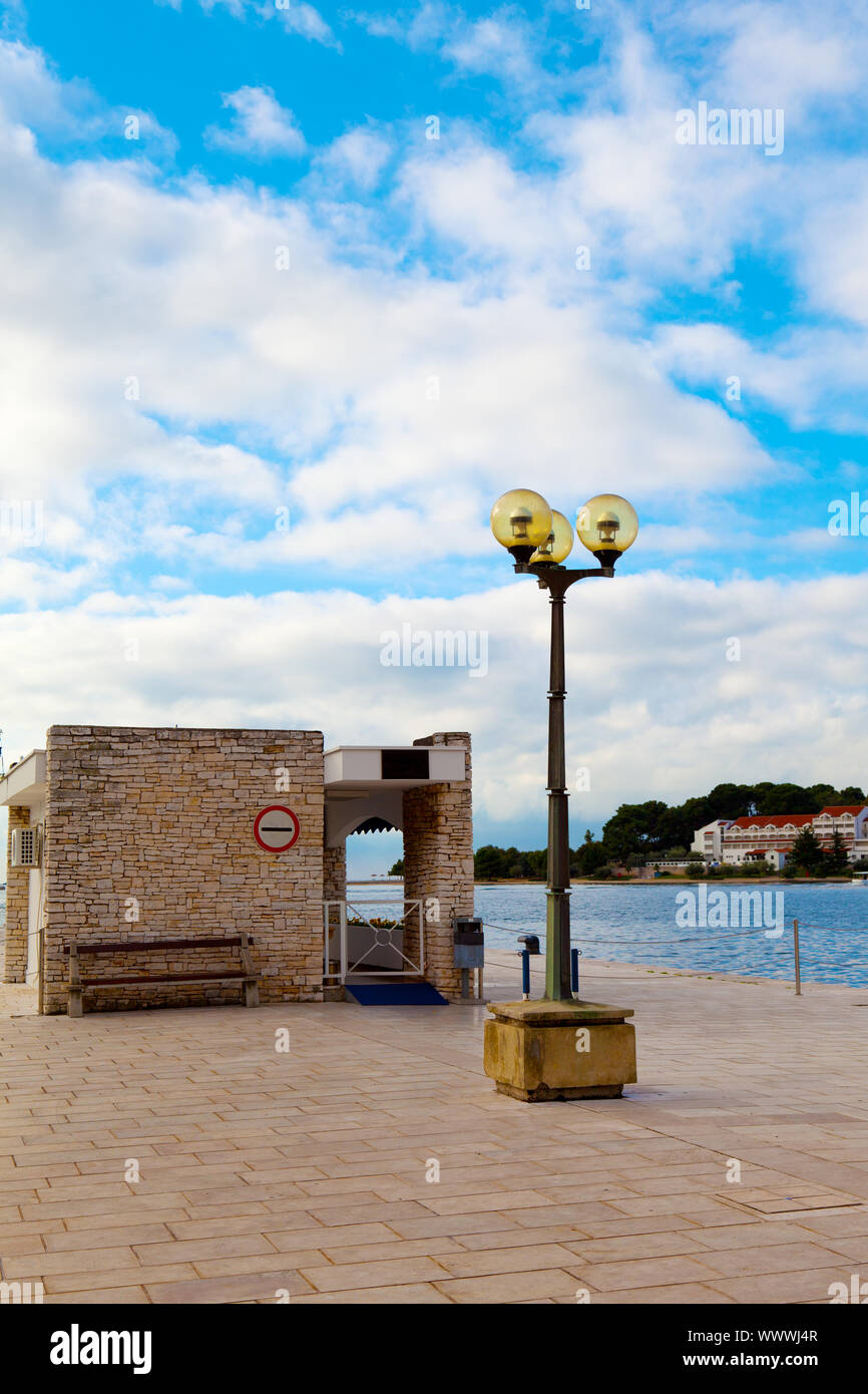 berth with street-lamp on sea background. Pula Croatia Stock Photo - Alamy